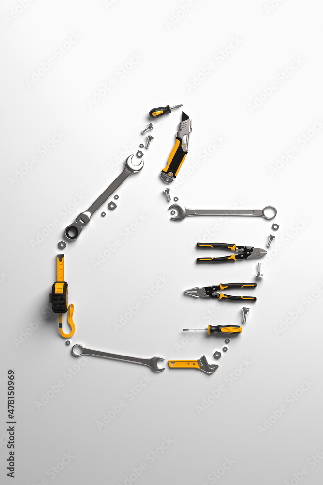 A symbolic thumbs-up sign made of construction tools on a white ...