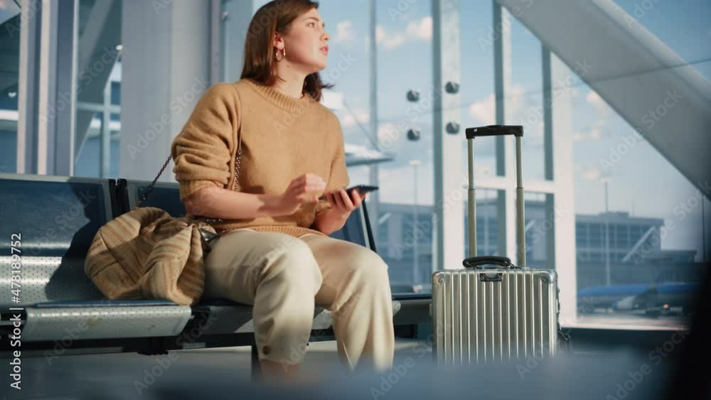 Video Stock Airport Terminal: Woman Waits for Flight, Uses Smartphone ...
