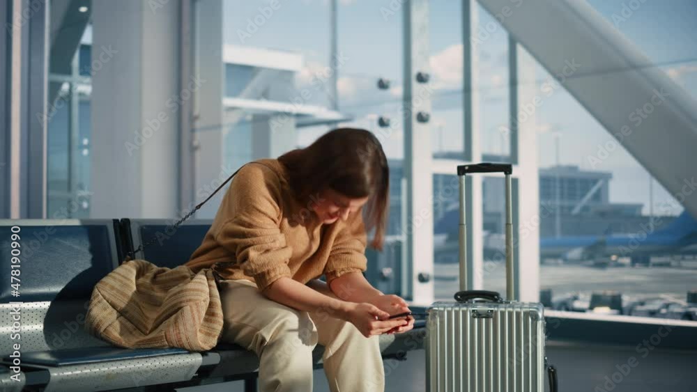 Airport Terminal: Woman Waits for Flight, Uses Smartphone, Receives ...