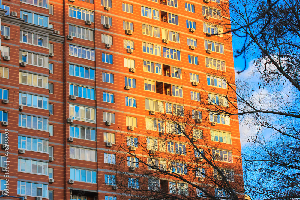 Kiev, Ukraine, January 2, 2022. Red brick wall of high-rise apartment ...