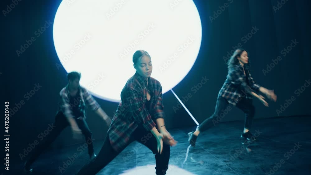 Diverse Group of Three Professional Dancers Performing a Hip Hop Dance ...