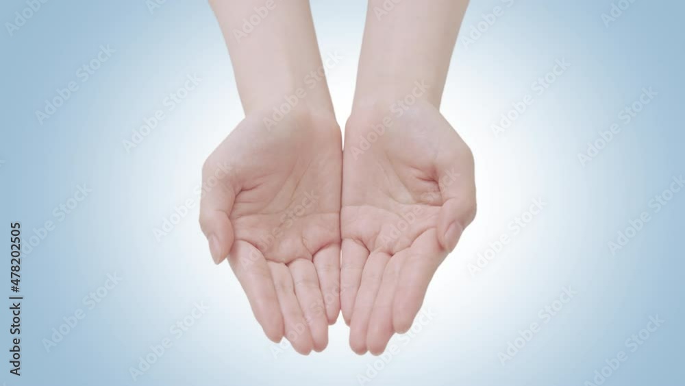 Female beauty hands showing palms top view in giving or receiving ...