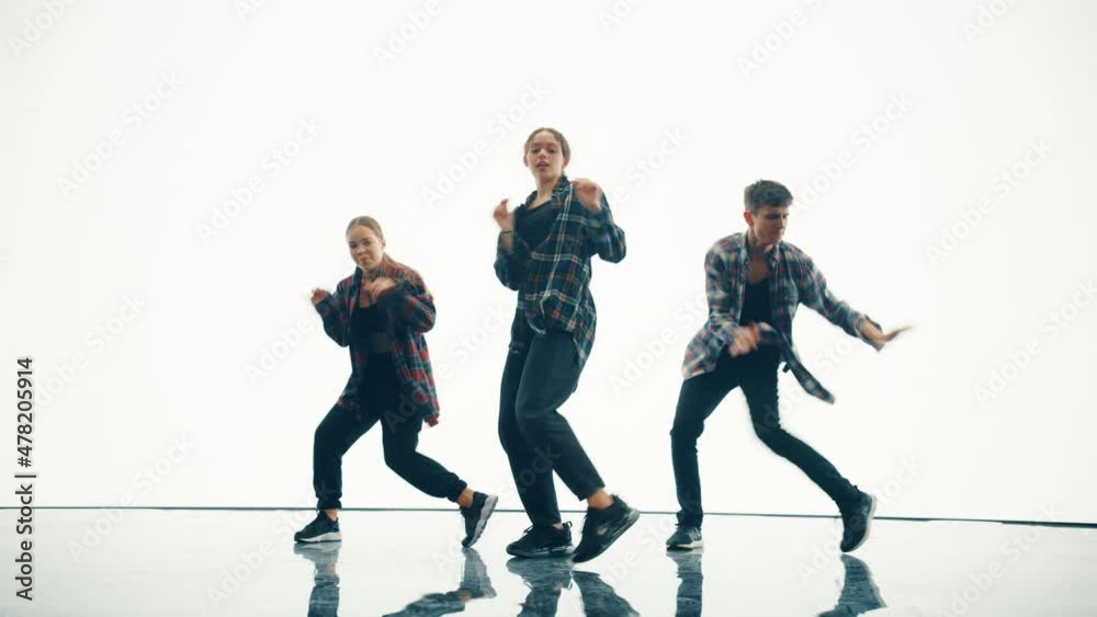Diverse Group of Three Professional Dancers Performing a Hip Hop Dance ...
