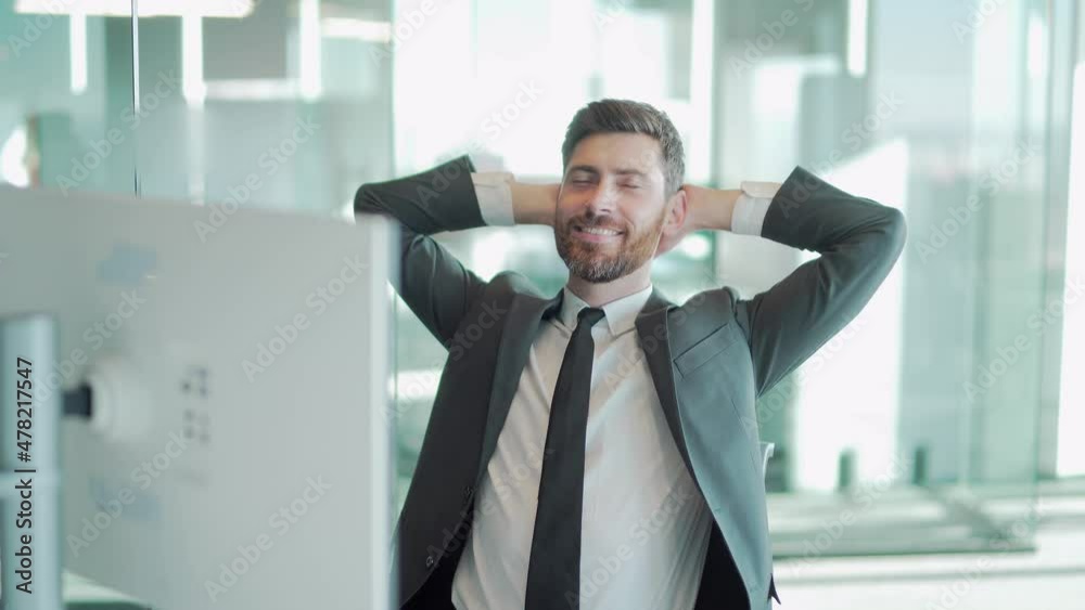 satisfied office worker dreams of vacation. Smiling businessman ...