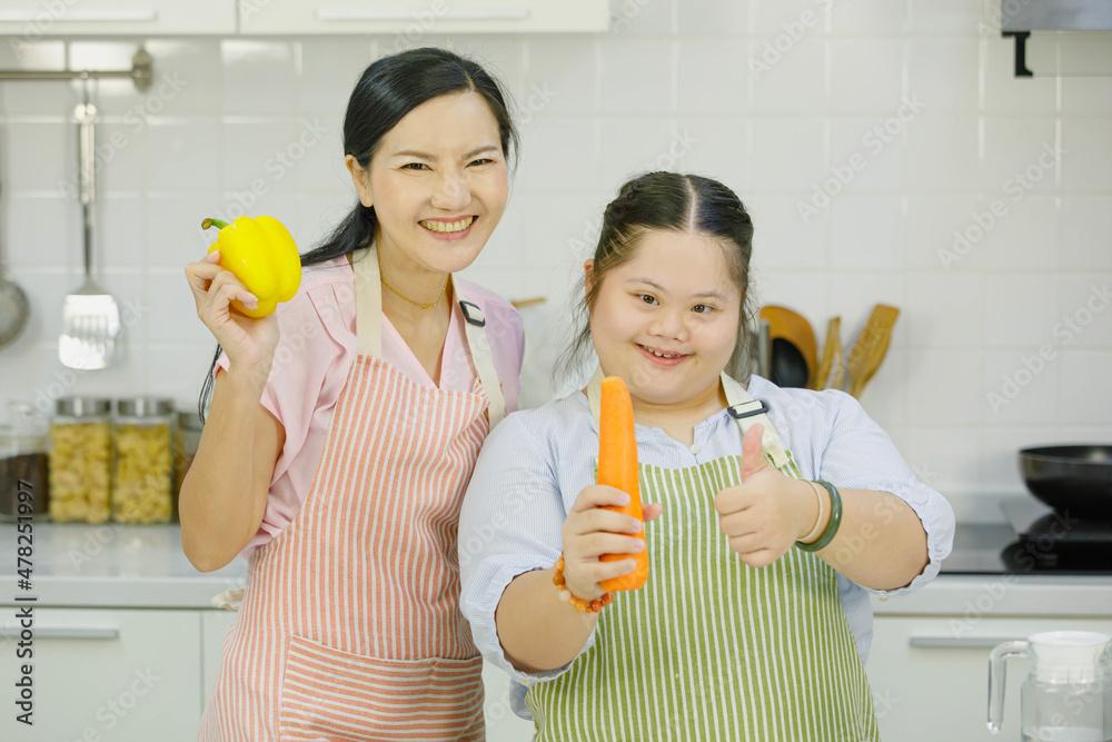 Portrait studio shot Asian young chubby down syndrome autistic daughter ...
