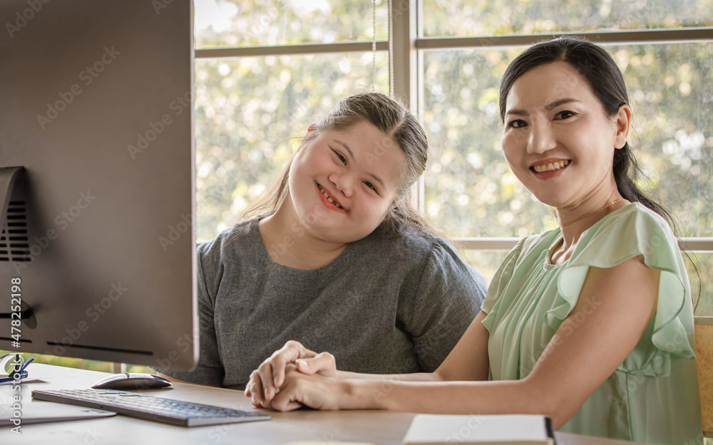 Portrait shot of Asian happy lovely young chubby down syndrome autistic ...