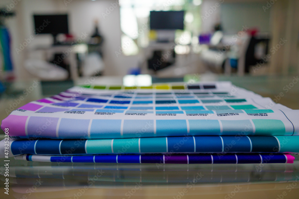 A blurred background photo of the inside of printing room. Color ...