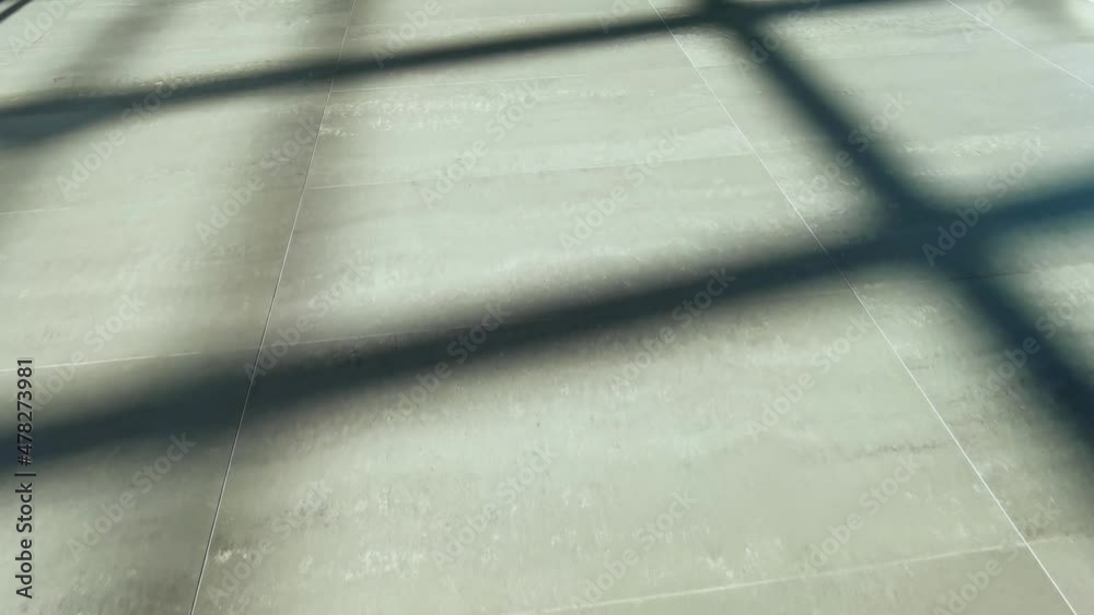 Mall cement floor shadows. Moving slow video. Grey background. Indoor ...