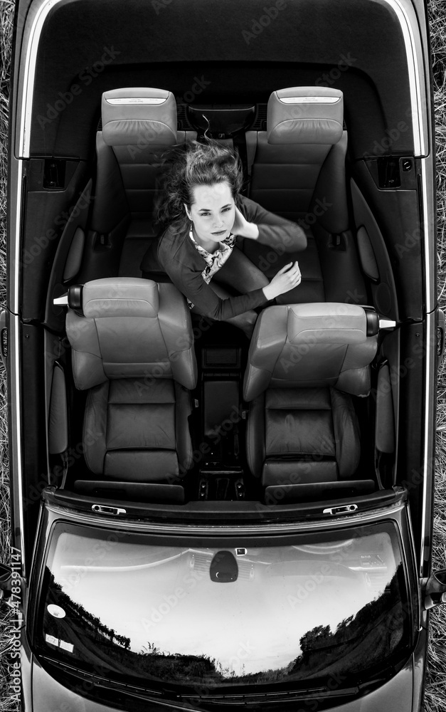 Beautiful girl and retro convertible, top view with drone Stock Photo ...