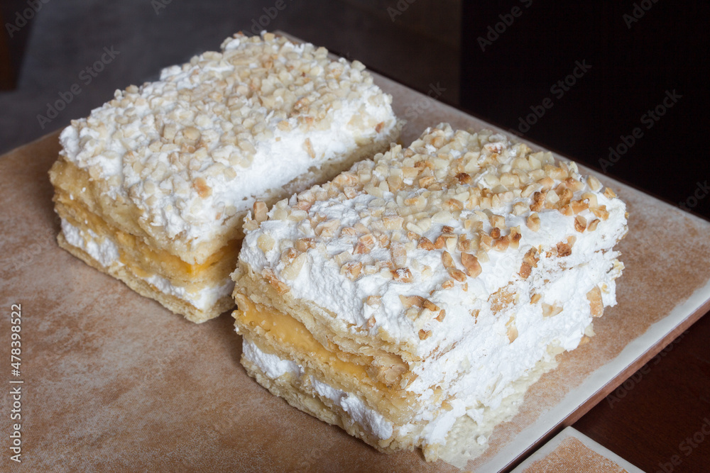 Two traditional dessert portions of Costrada on an artistic modern ...