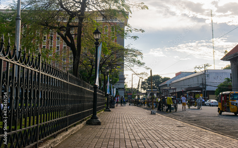 Walking along the sidewalk in park. Intramuros, Manila, Philippines ...