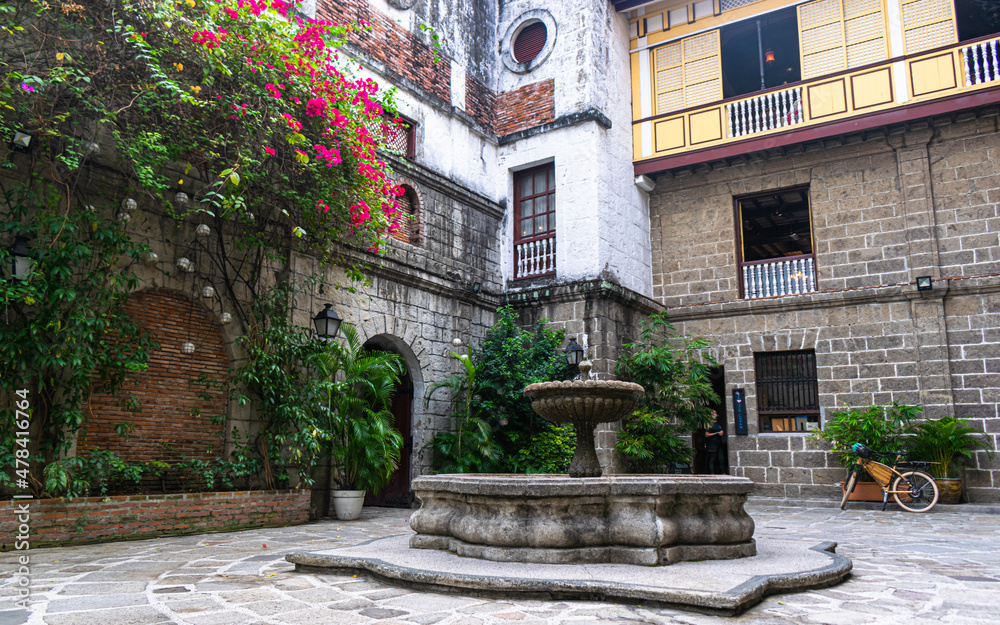 Old fountain in the middle of a Spanish colonial era park. Intramuros ...