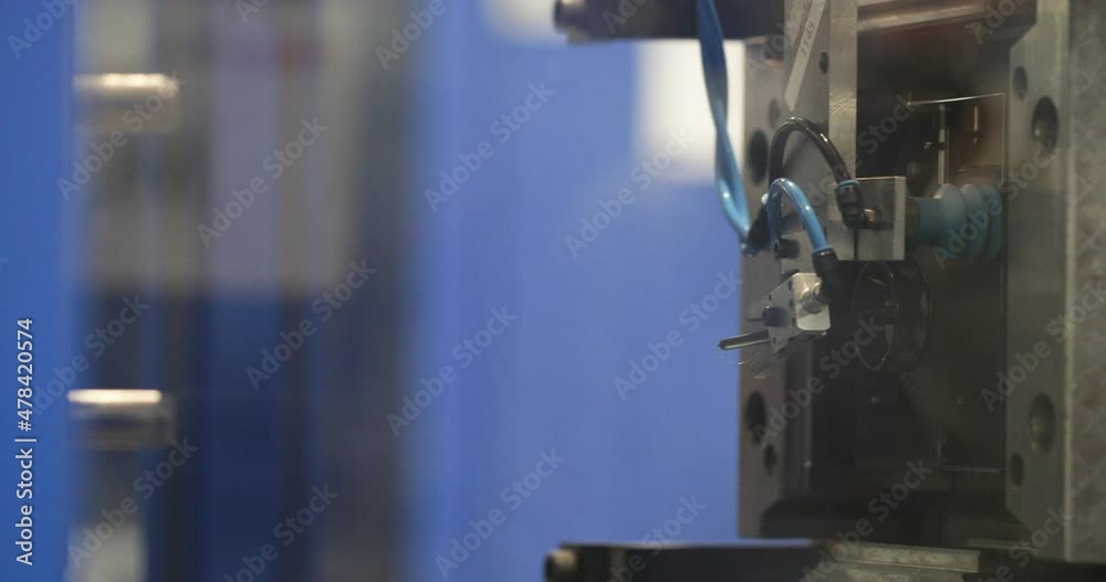 Ejecting Unit Of A Plastic Injection Molding Machine. Molded Plastic ...