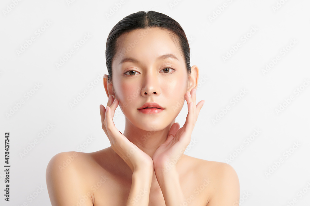Beautiful young asian woman with clean fresh skin on white background ...