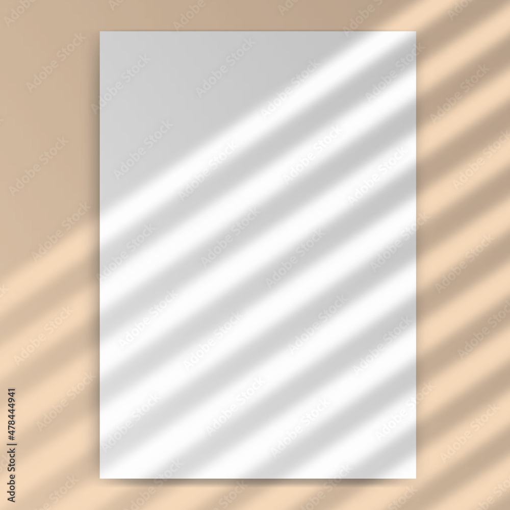 Vertical mock up of empty paper blank. Reflected blinds shadow from ...