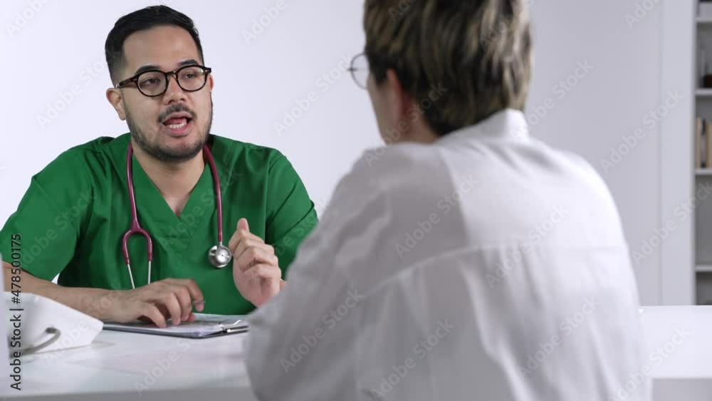 Vidéo Stock Kind comforting and attentive. Smiling young Asian male ...