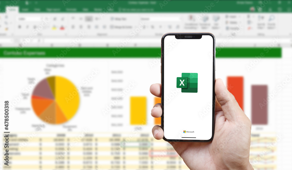 Microsoft Excel app on smartphone screen and Microsoft Excel program ...