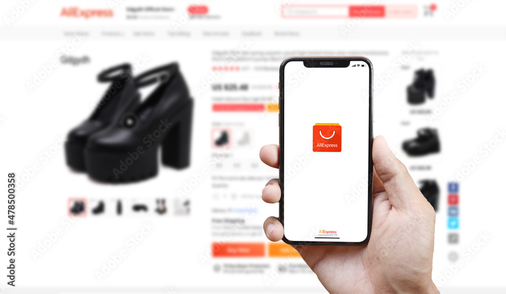 Aliexpress app on smartphone screen and Aliexpress web background on ...