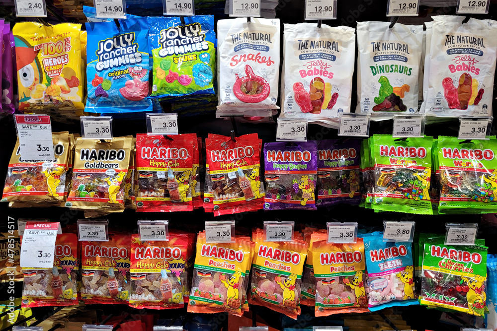 Various choices of imported sweet candy display on shelf in Mercato ...