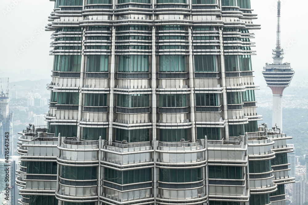 Facade of the iconic Petronas Towers, with Menara KL communications ...