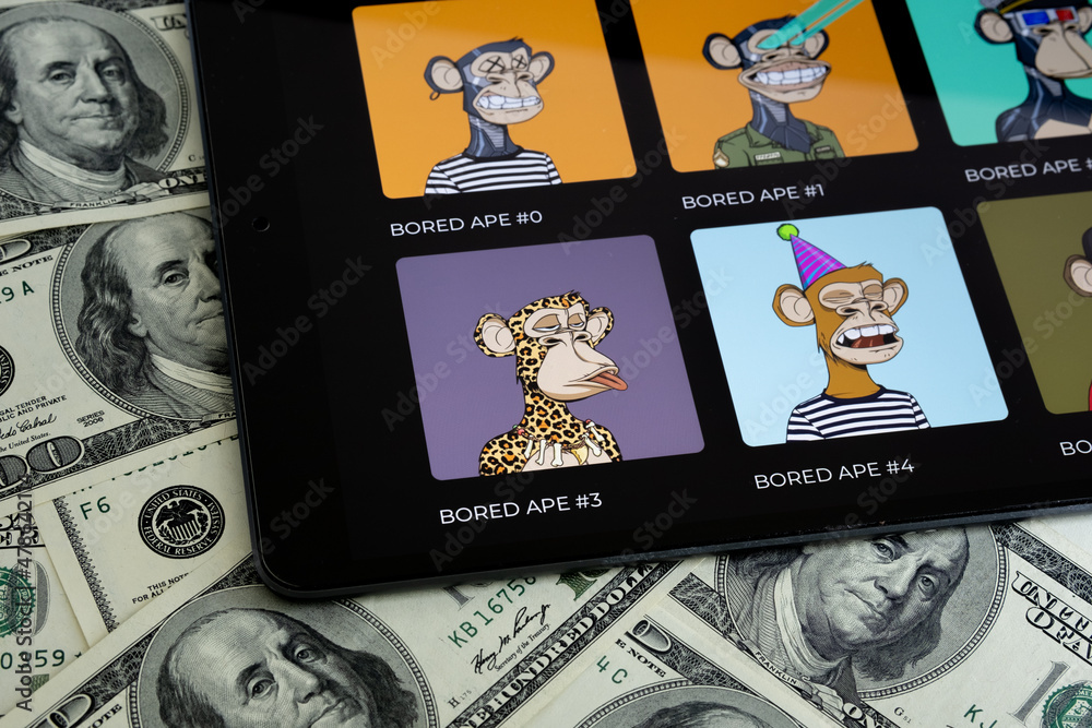 BORED APE NFT digital art collection seen on tablet screen placed on ...