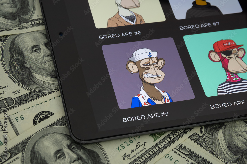 BORED APE NFT digital art collection seen on tablet screen placed on ...