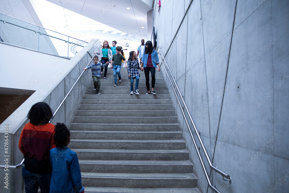 Children and parents walking on stairs Stock Photo | Adobe Stock