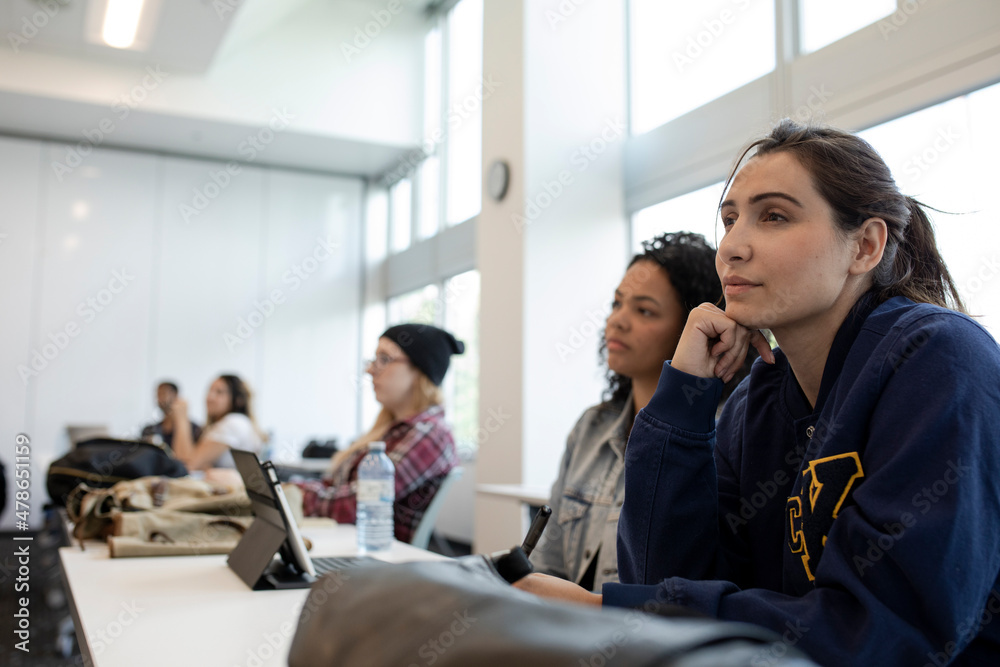 Students sitting and concentrating in university lecture Stock Photo ...