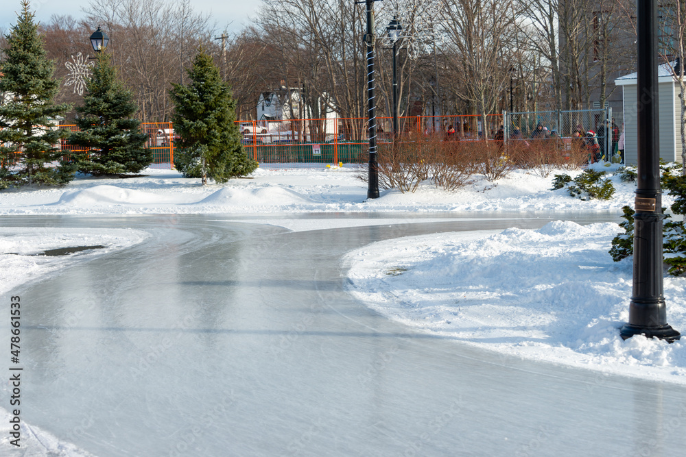 A curved ice surface at an outdoor park. There are a number of turns in ...