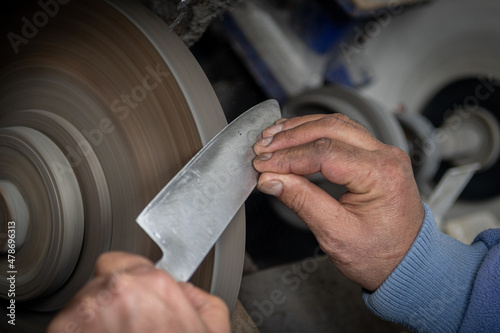 Isolated close up of chef knife sharpening, honing and stropping ...
