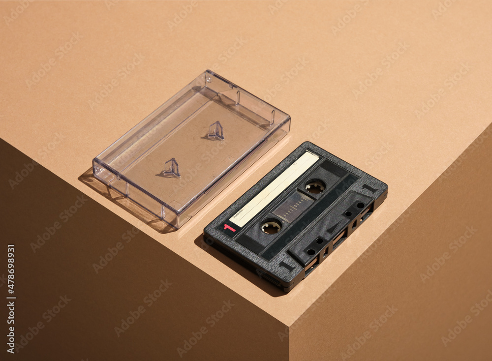 Audio cassette and box from her lies on the corner. Idea retro parties ...
