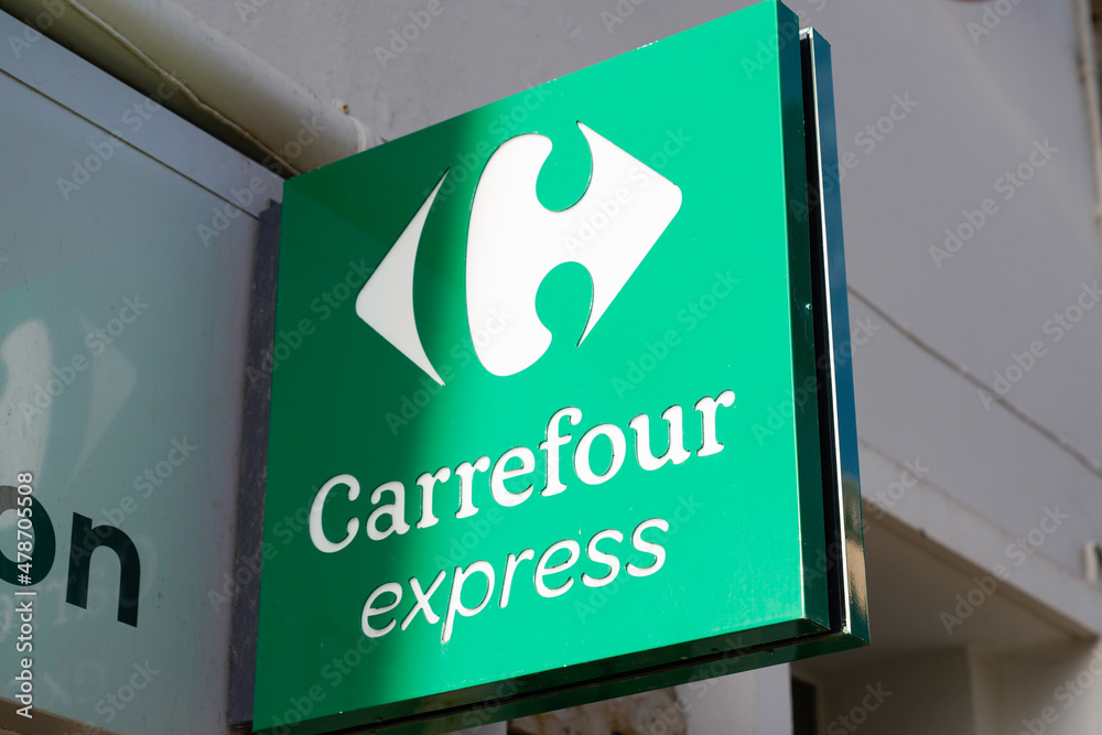 Carrefour express logo sign green on supermarket brand store Stock ...