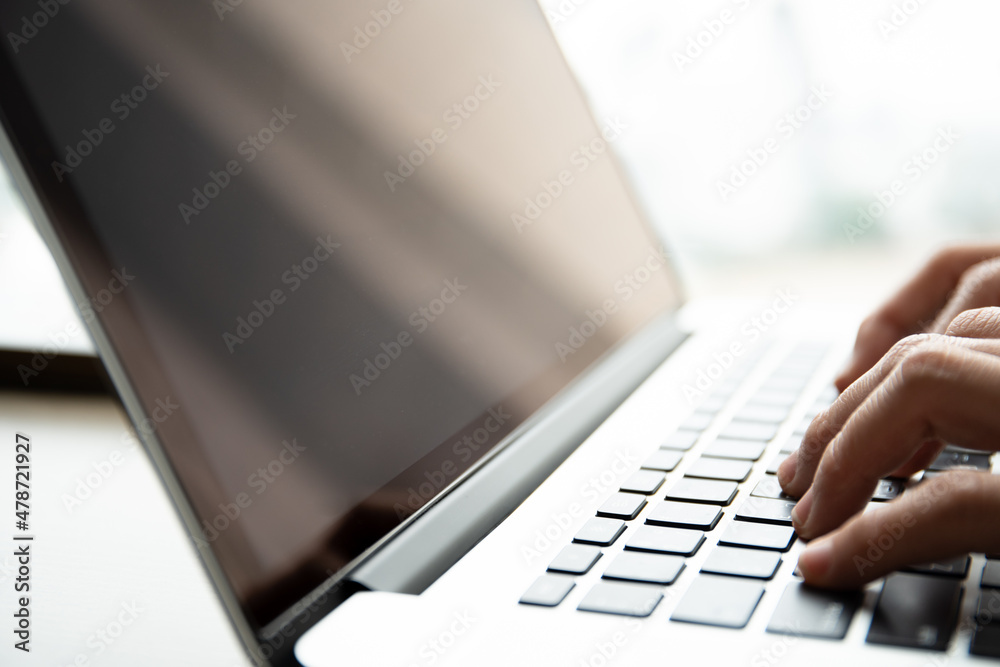 Happy Asian young woman making a video conference on laptop computer ...