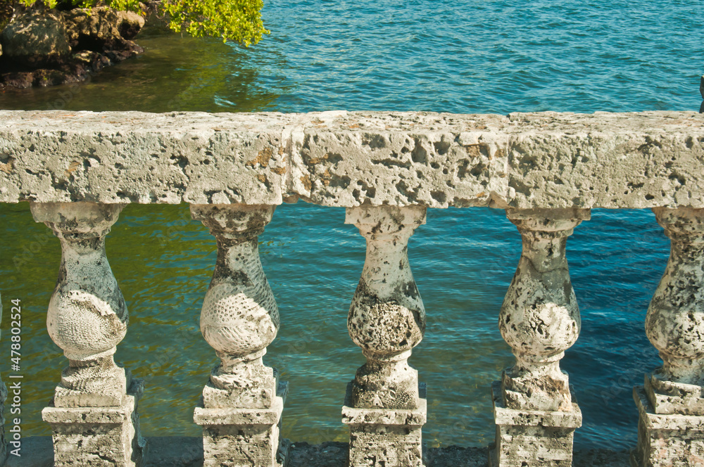 front view, medium distance of coral-concrete railing and supporting ...