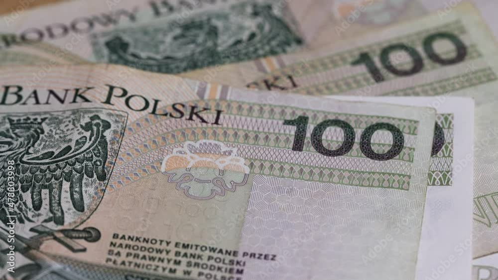 Slowly counting Polish banknotes from 100 PLN, 200 PLN till 500 PLN ...