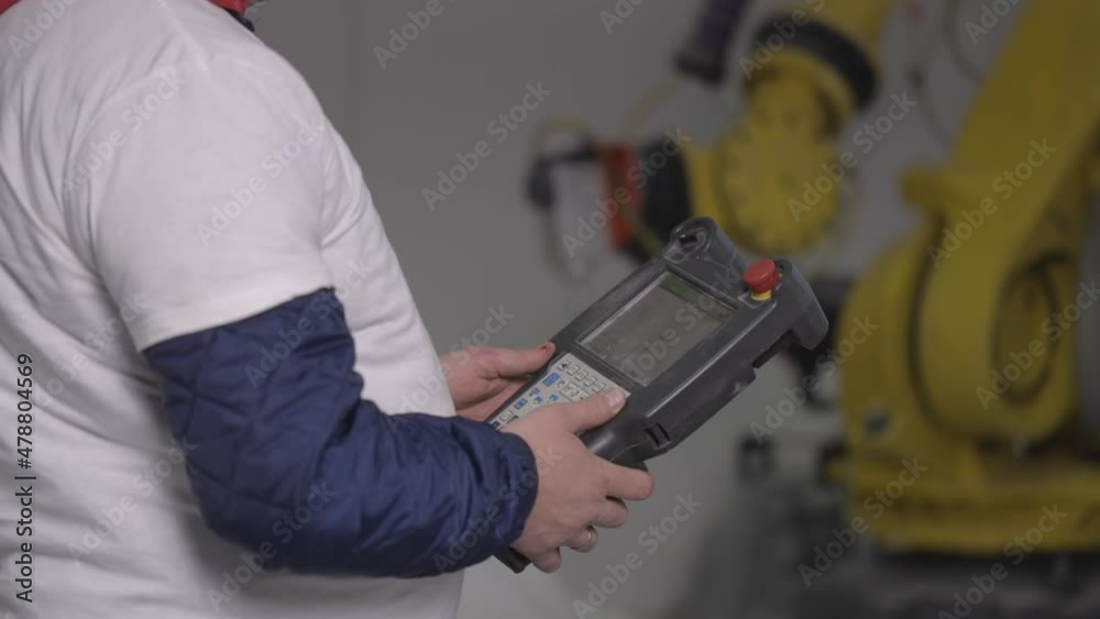 Engineer technician control manage robot arm with remote control heavy ...