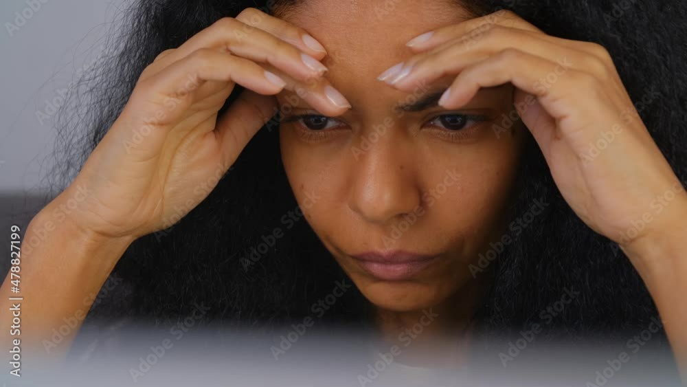 Black woman in despair. Unhappy female staring in computer screen. Sad ...