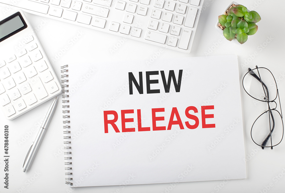 Office desk table with keyboard, notepad and calculator. Top view with ...