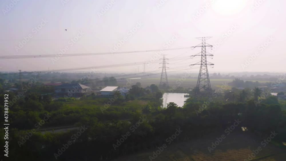 High voltage poles with nature landscape. Power lines on utility tower ...