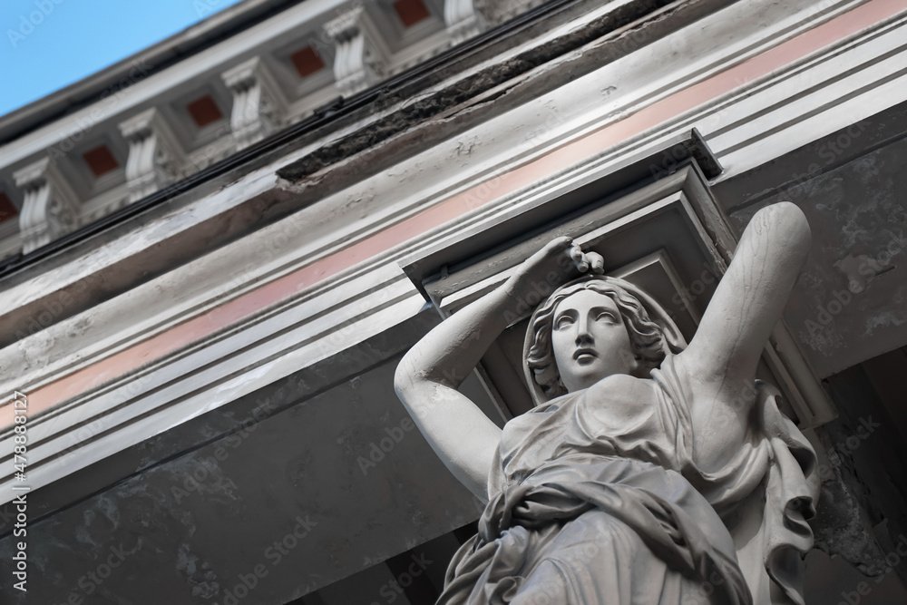 Antique greek caryatid woman in tunic supports balcony, neo-renaissance ...