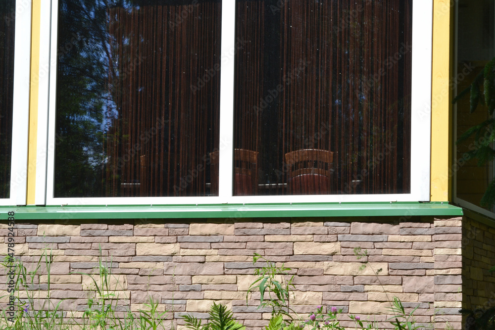 Wall cladding with natural stone panels in pastel colors. Coating for ...