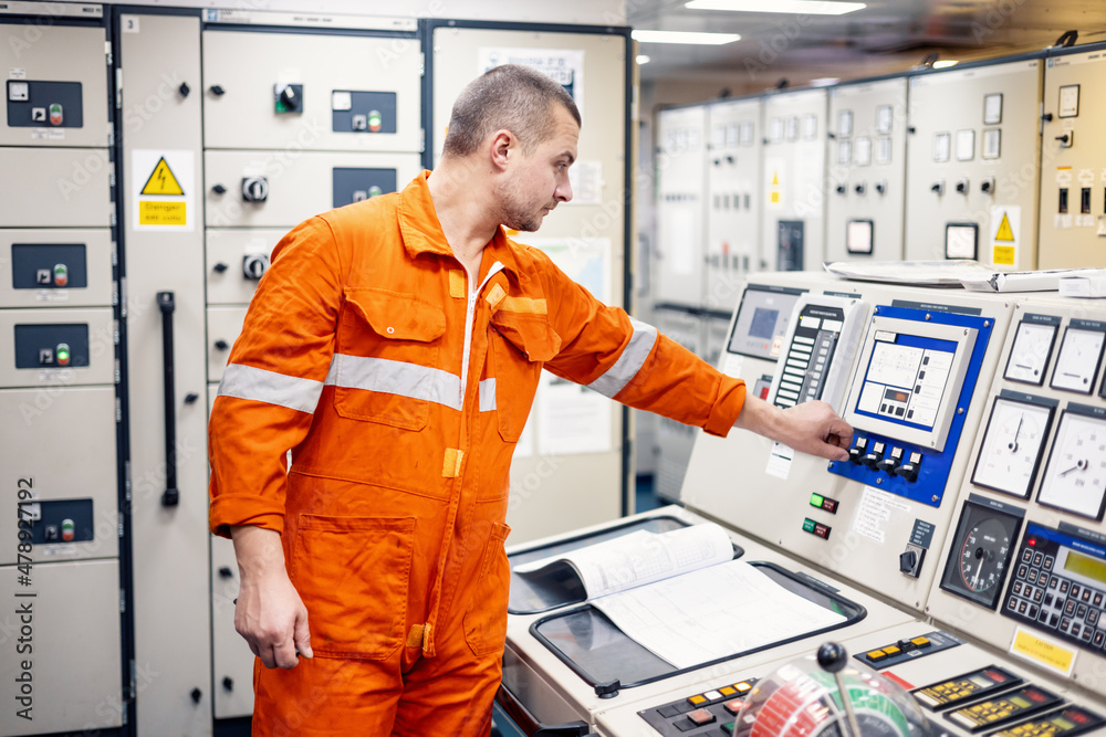 Marine officer in engine control room ECR Stock Photo | Adobe Stock