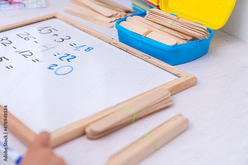 Erasable whiteboard with sums Stock Photo | Adobe Stock