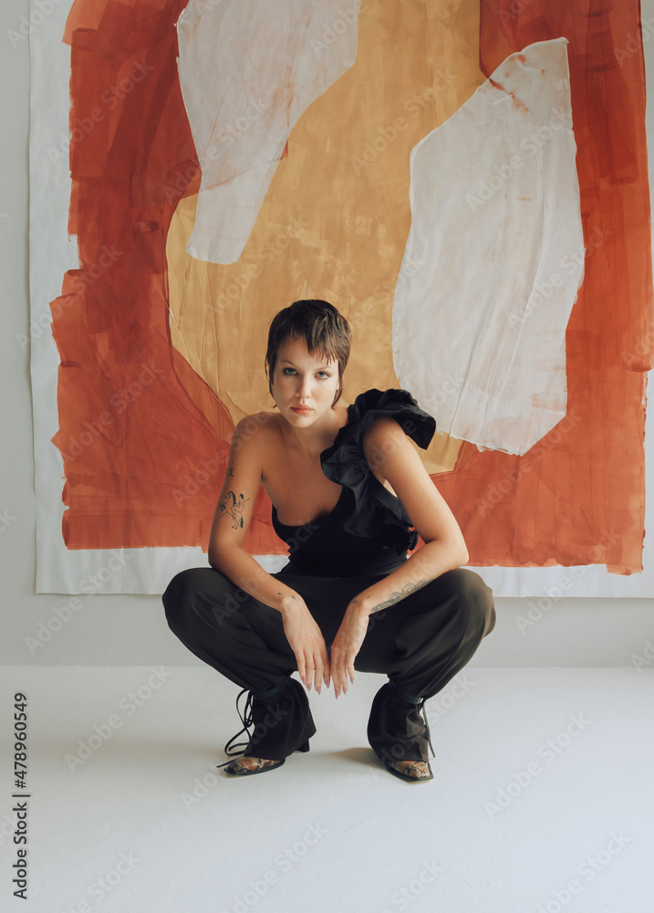 Fashion Top Model In Front of Abstract Paintings. Stock Photo | Adobe Stock