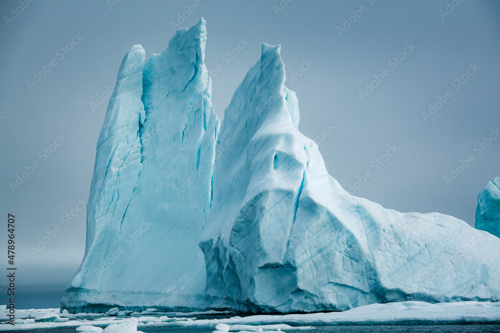 Icebergs floating in the melting sea ice in the Davis Strait. Stock ...