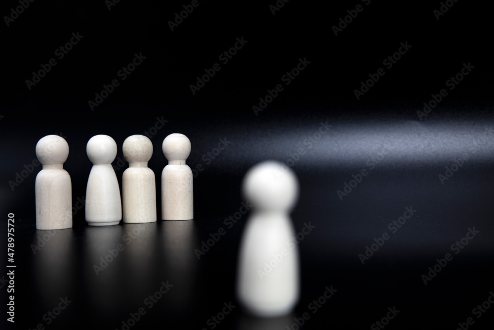 One child figure standing outside the group being excluded. Concept ...