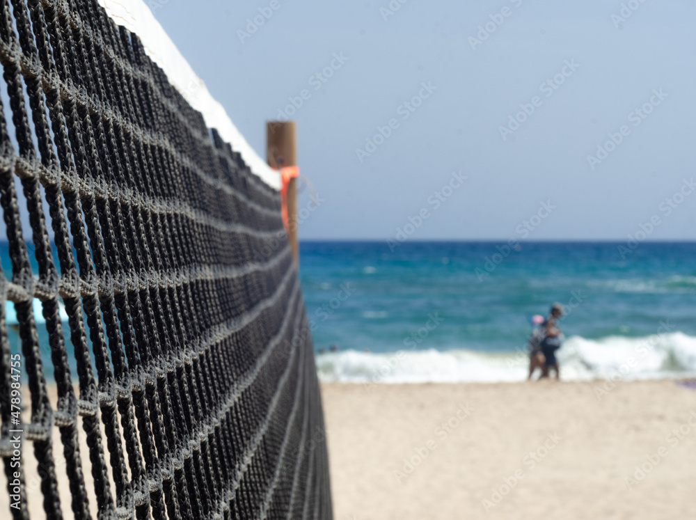 volleyball net on the beach. empty volleyball court but two ...