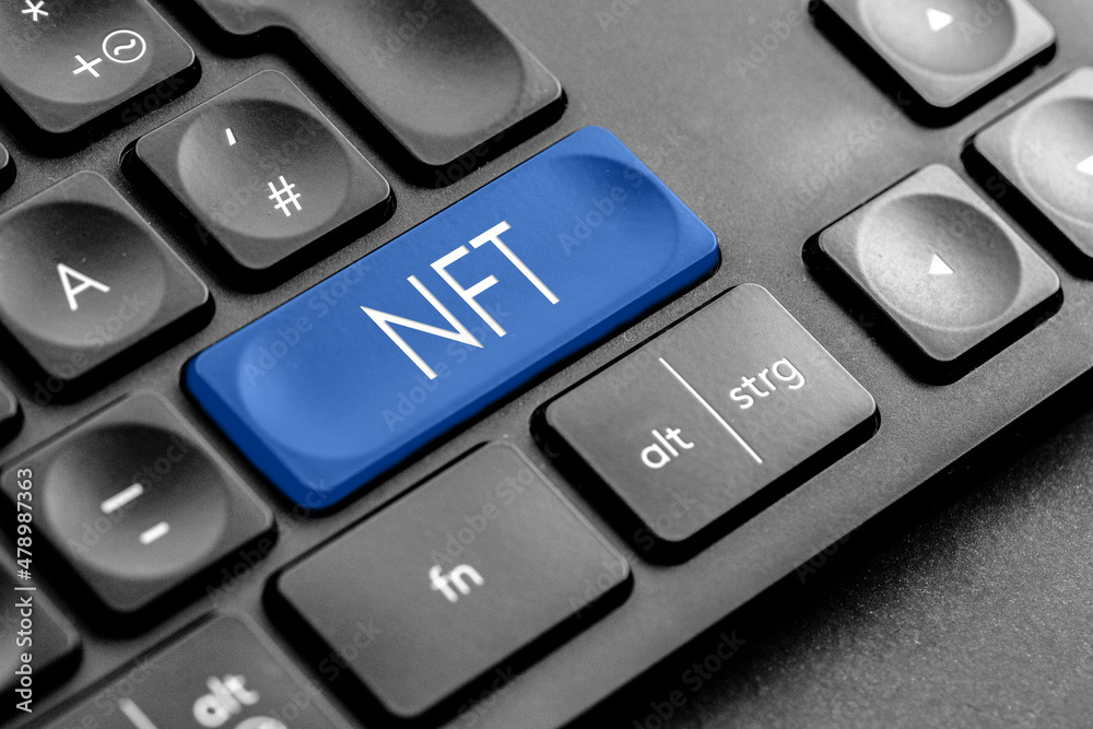 blaue "NFT" Taste auf einer dunklen Tastatur Stock Photo | Adobe Stock