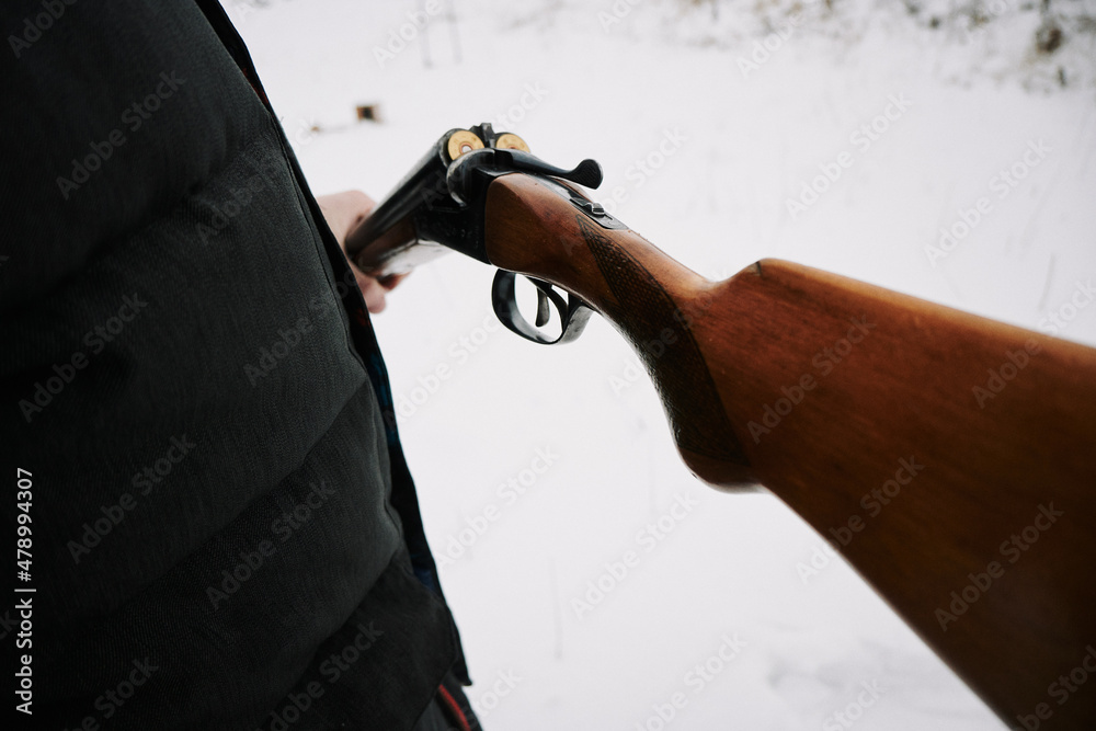 16 gauge double-barreled shotgun against a background of snow Stock ...