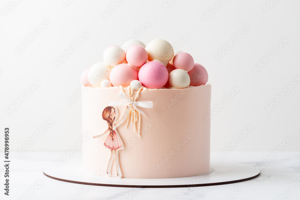 Birhtday cake for a girl with chocolate spheres decoration on top ...